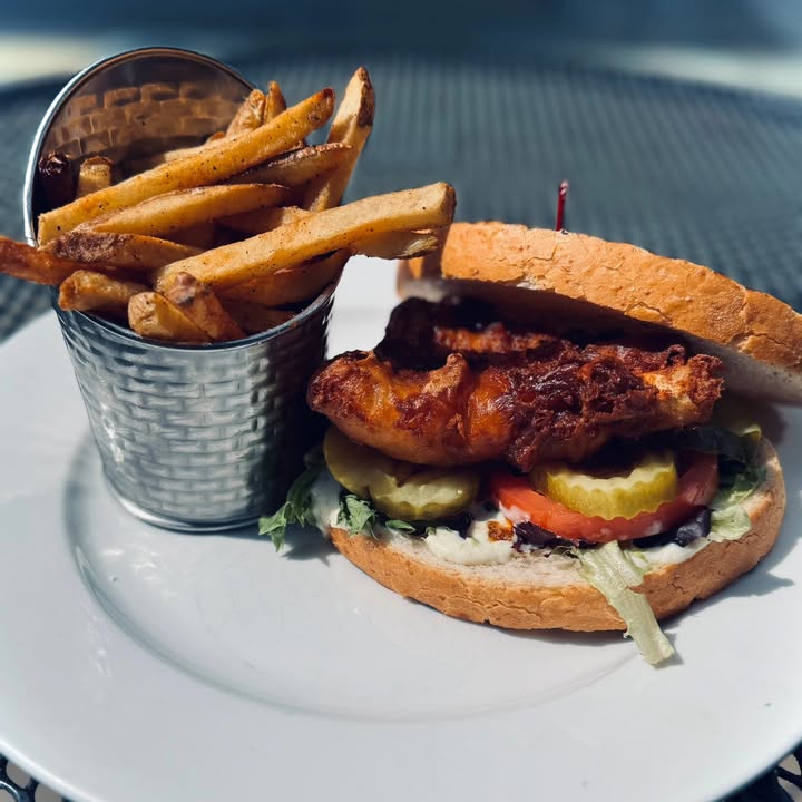 The Brick fish sandwich...lettuce, pickle, tomato, and tartar sauce ...